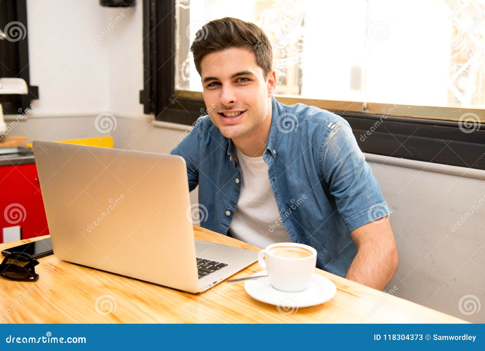 Young Student Man Working and Studying on Computer in Coffee Shop Stock ...