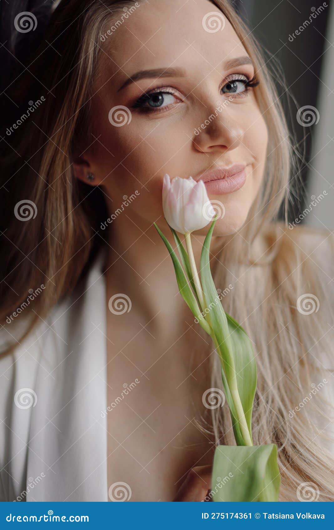 Portrait Of Young Cheerful Gorgeous Woman With Long Hair Wearing White