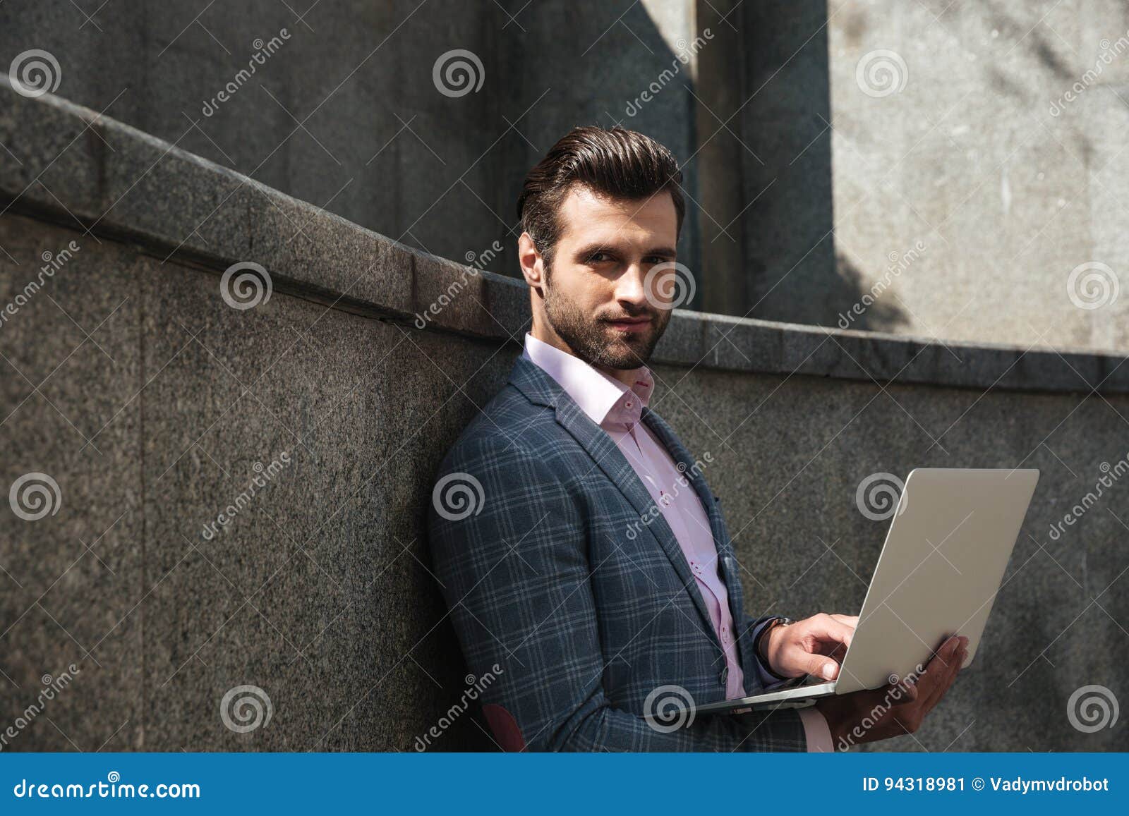 Portrait of Young Confident Man in Suit Using Laptop Computer Stock ...