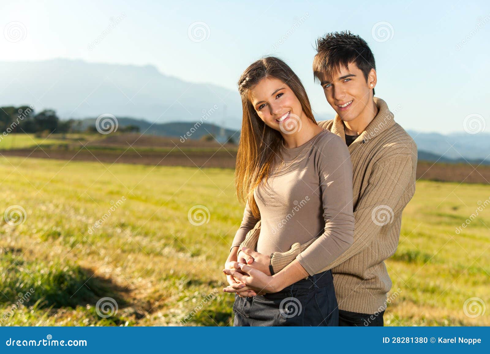 Portrait of Young Couple in Countryside. Stock Photo - Image of looking ...
