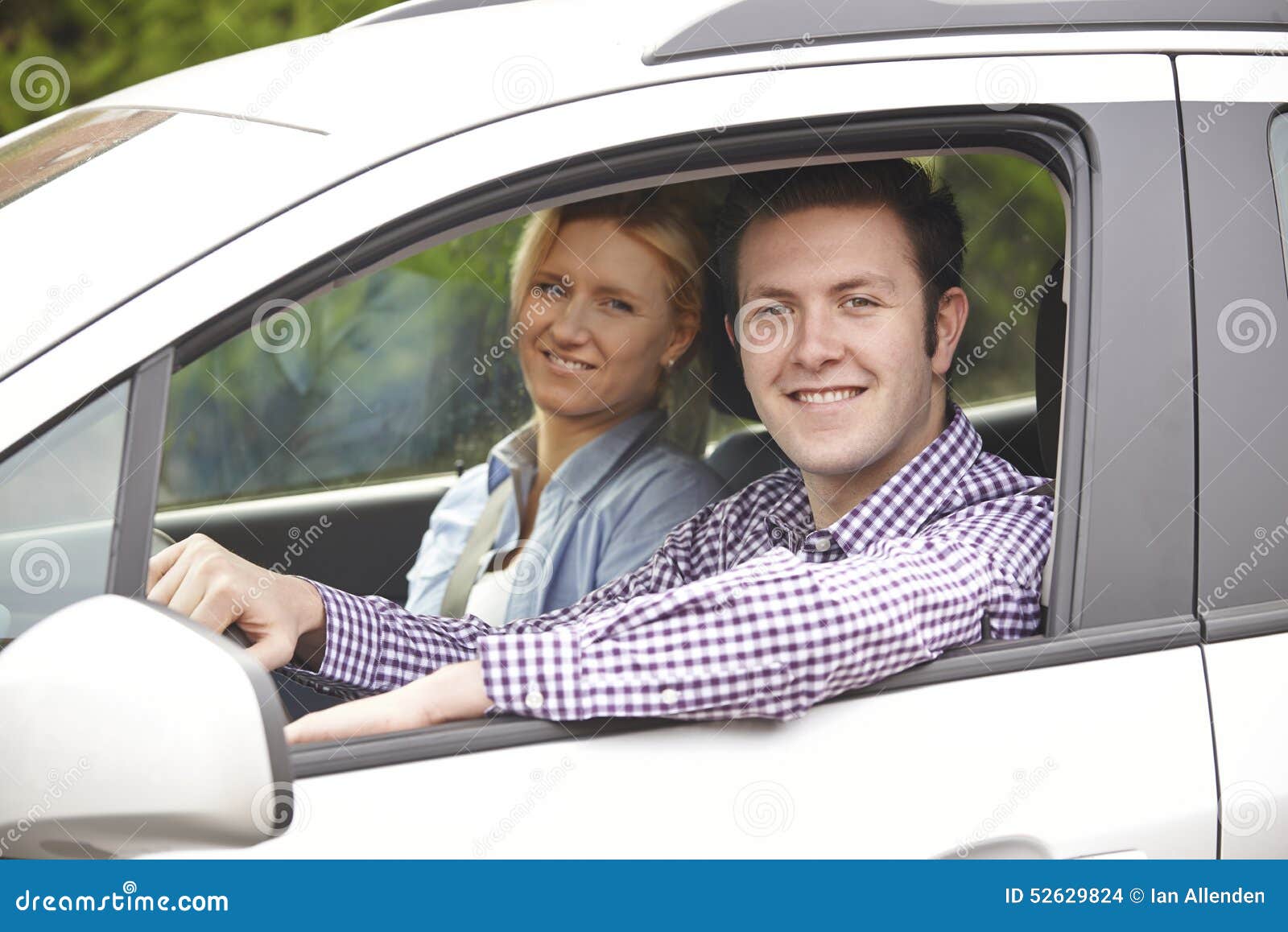 Portrait of Young Couple Looking Out of Car Window Stock Photo - Image ...