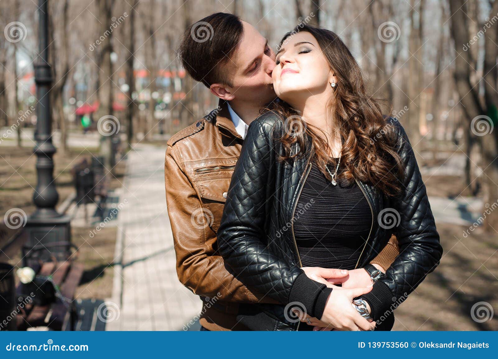 Portrait of Young Couple in Love in a Park Stock Photo - Image of ...