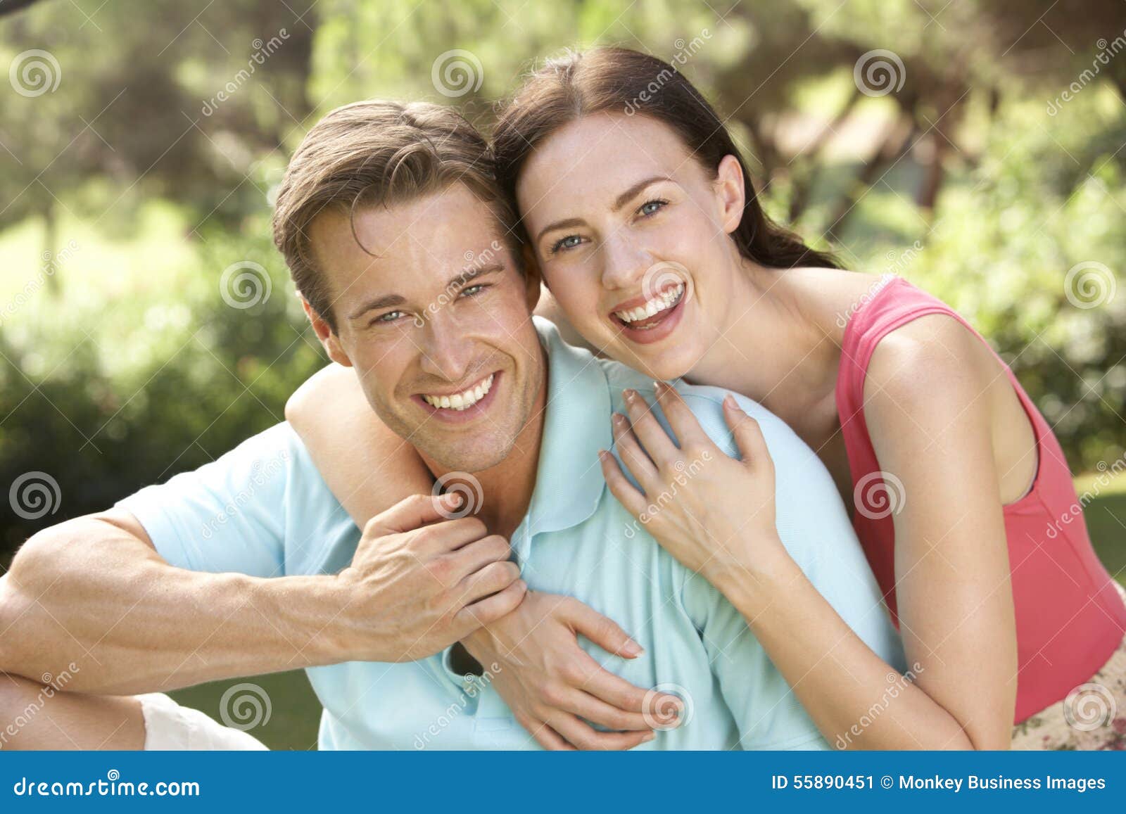 Portrait of Young Couple Relaxing in Countryside Stock Image - Image of ...