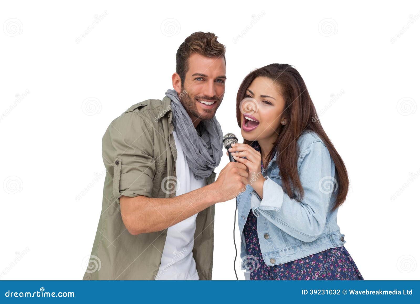 Portrait of a Young Couple Singing into Microphone Stock Photo - Image ...