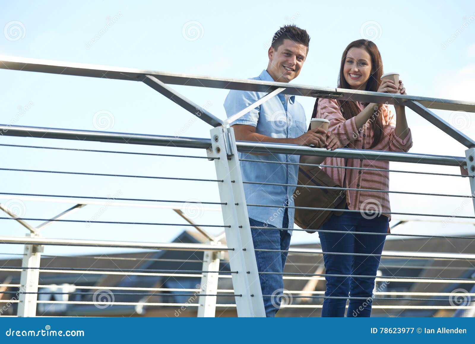Portrait of Young Couple Walking To Work Over Bridge Stock Image ...