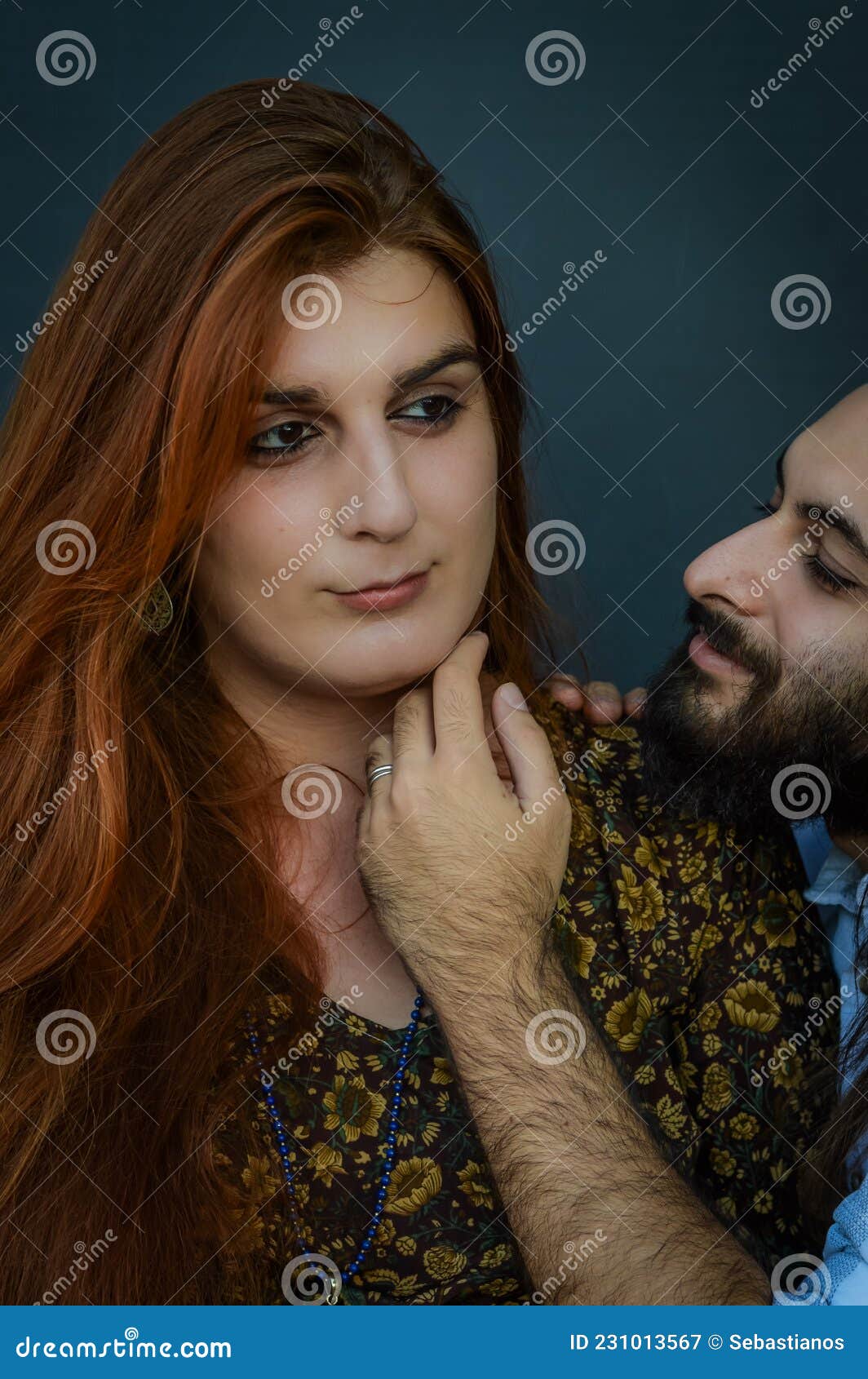 Portrait Of A Young Couple Where The Young Man With Beard And Long Hair