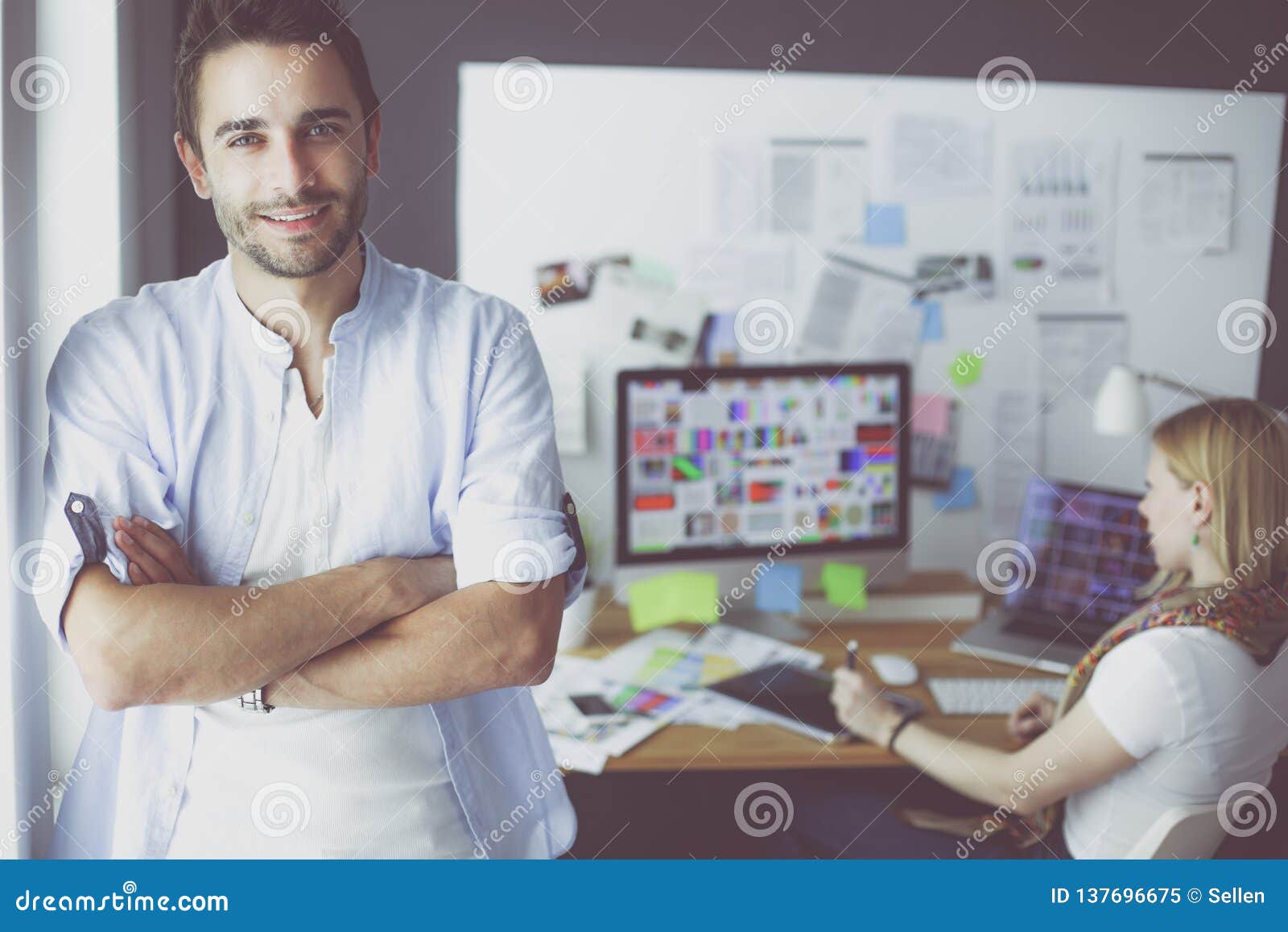 Portrait of Young Designer in Front of Laptop and Computer while ...