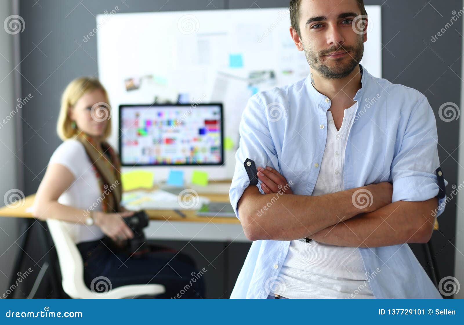 Portrait of Young Designer in Front of Laptop and Computer while ...