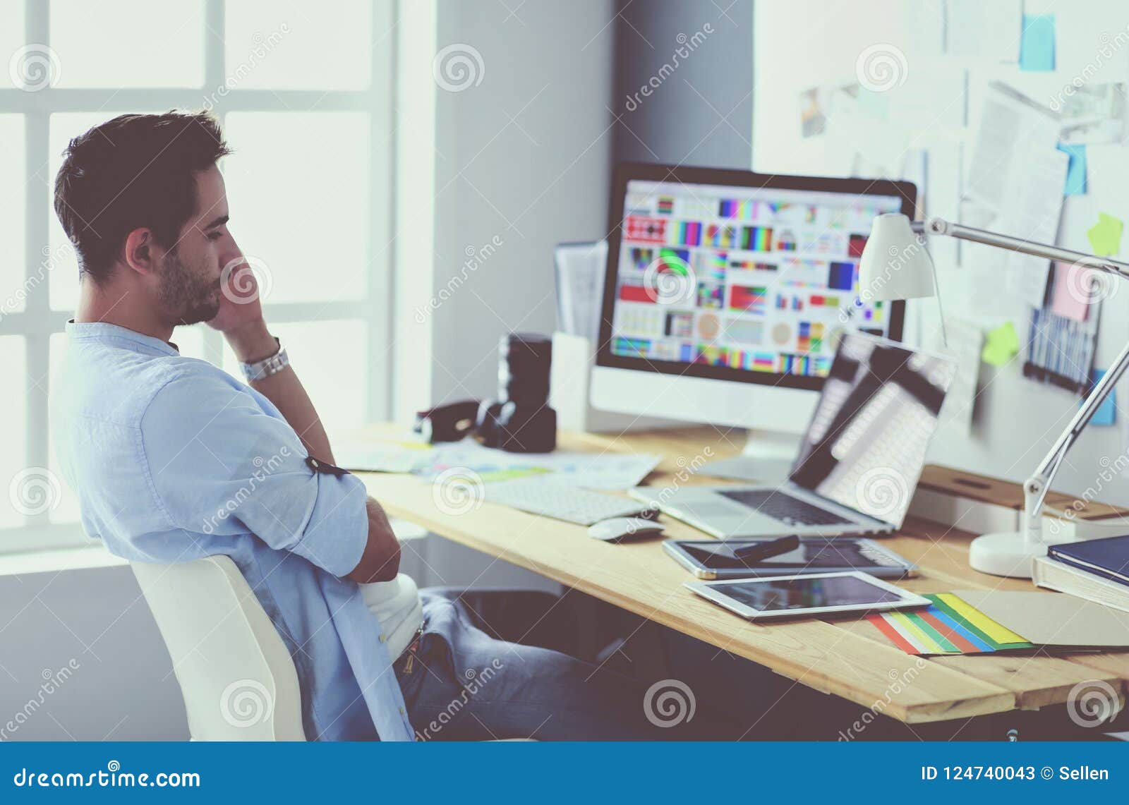 Portrait of Young Designer Sitting at Graphic Studio in Front of Laptop ...
