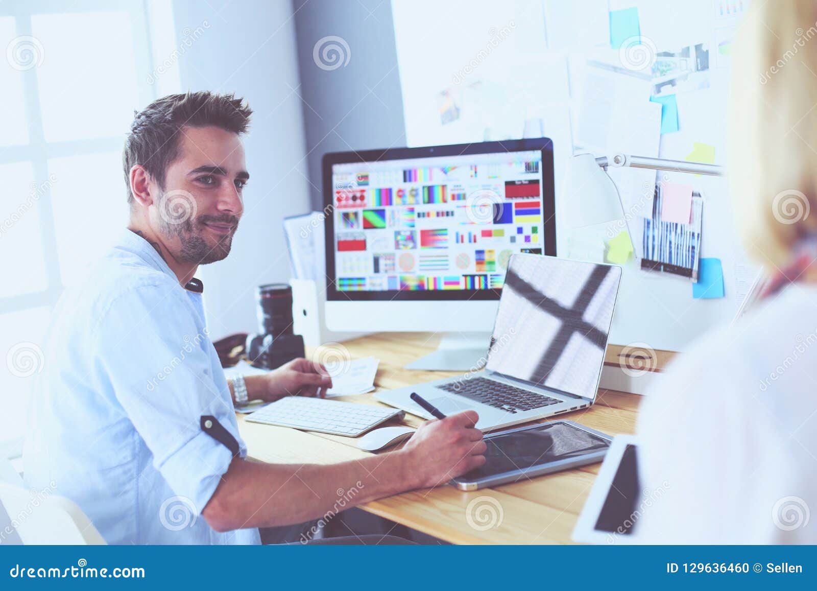 Portrait of Young Designer Sitting at Graphic Studio in Front of Laptop ...