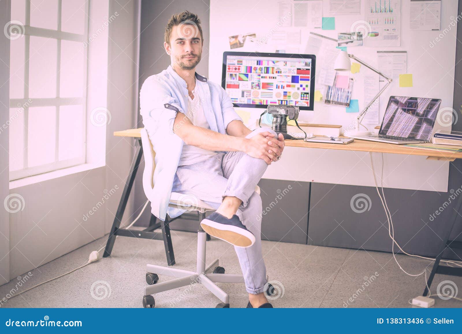 Portrait of Young Designer Sitting at Graphic Studio in Front of Laptop ...