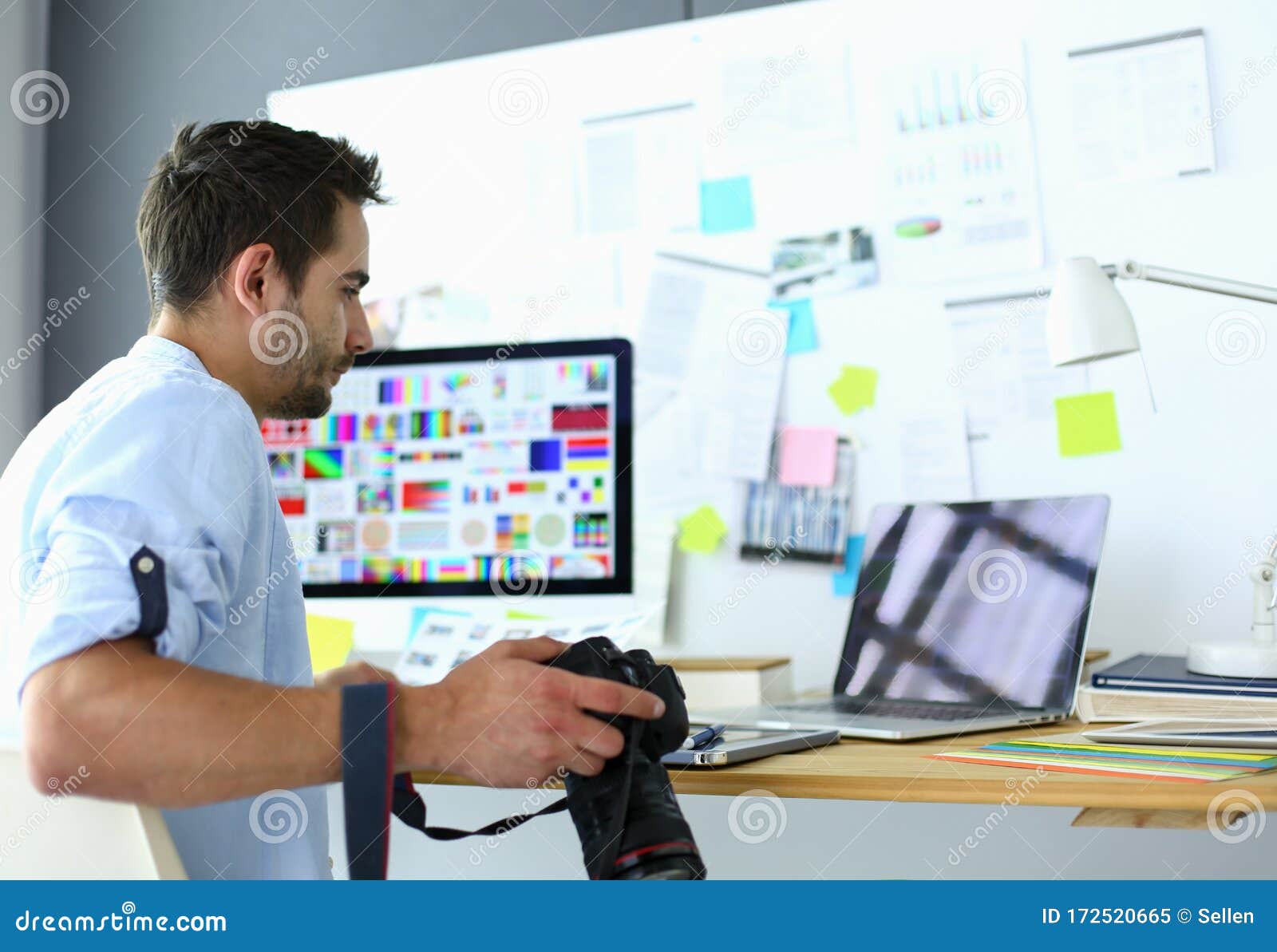 Portrait of Young Designer Sitting at Graphic Studio in Front of Laptop ...