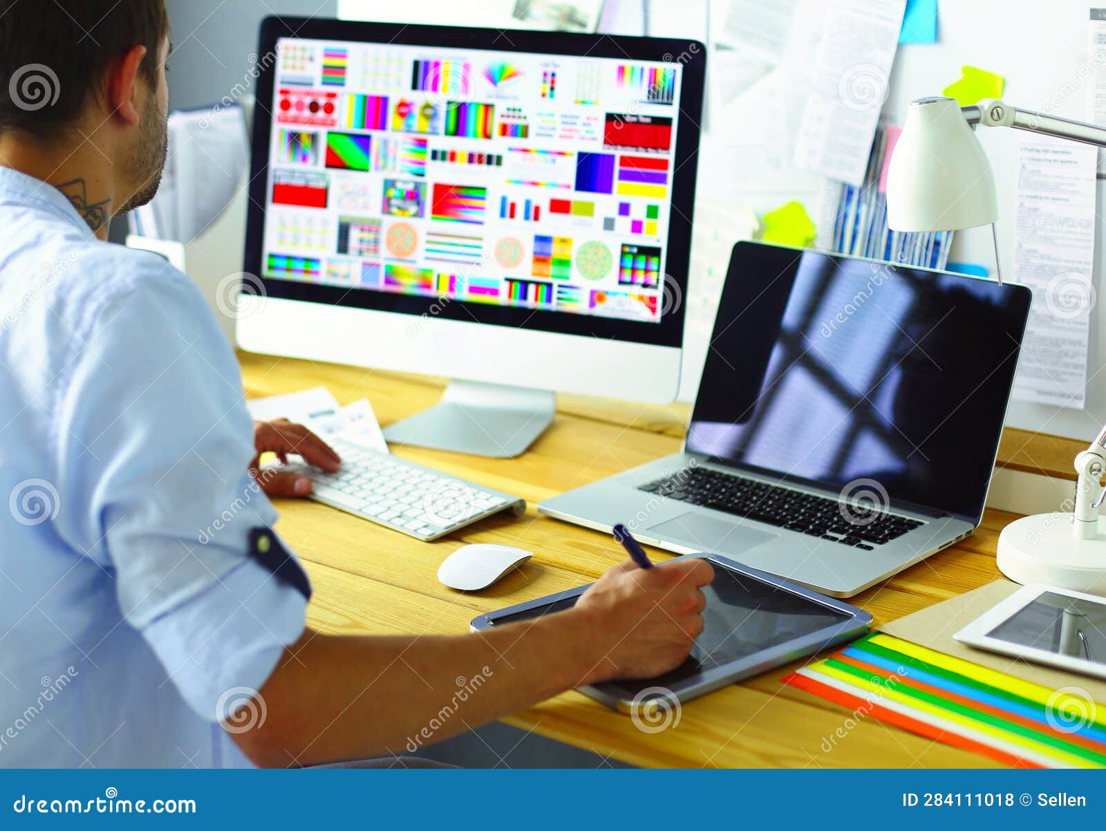 Portrait of Young Designer Sitting at Graphic Studio in Front of Laptop ...
