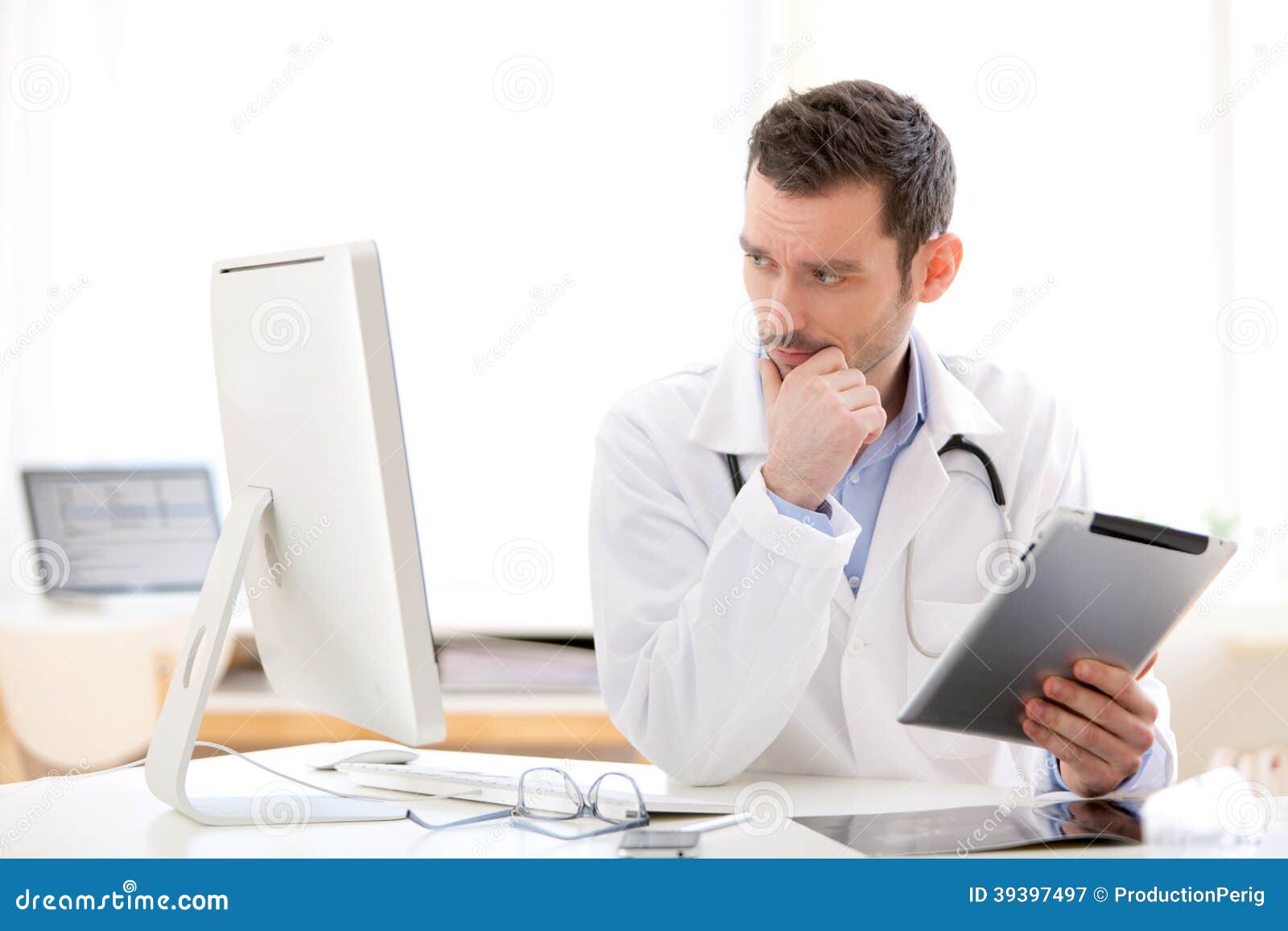 Portrait of a Young Doctor Using Tablet at Work Stock Image - Image of ...