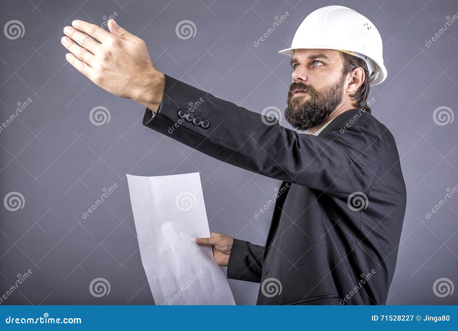 Portrait Of Young Engineer Holding Plan Drawings And Explaining Stock ...