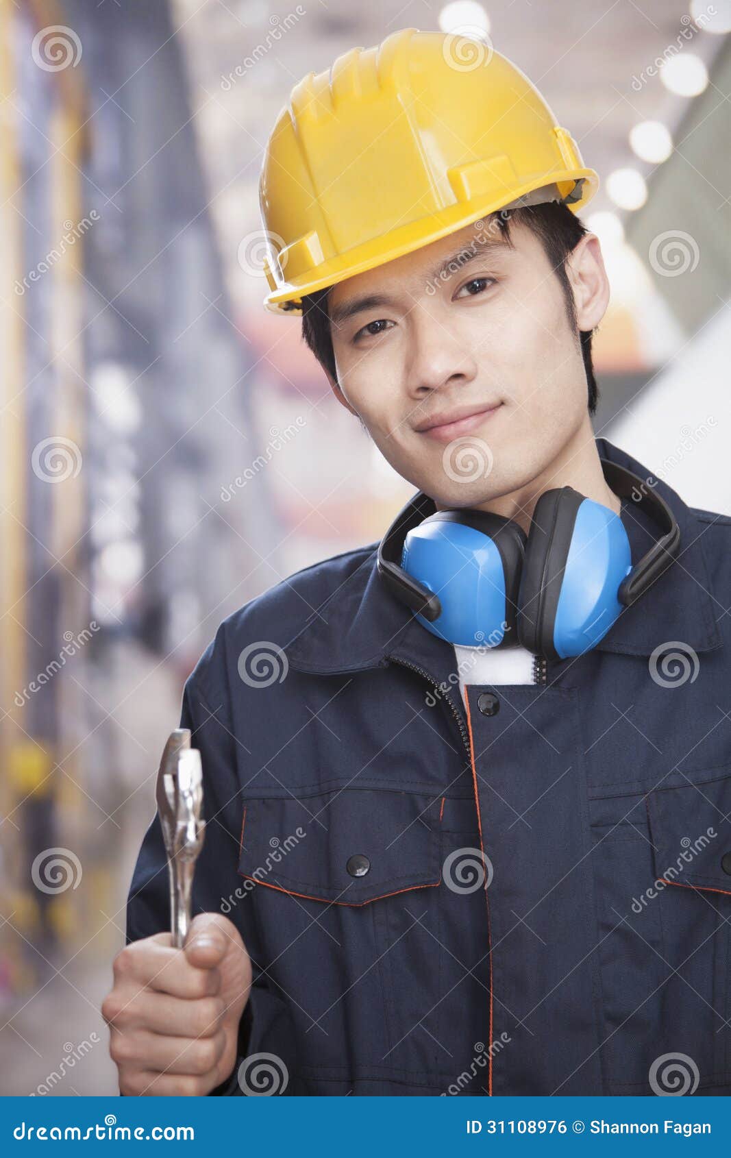 Portrait of Young Engineer Holding a Wrench and Wearing a Hardhat Stock ...