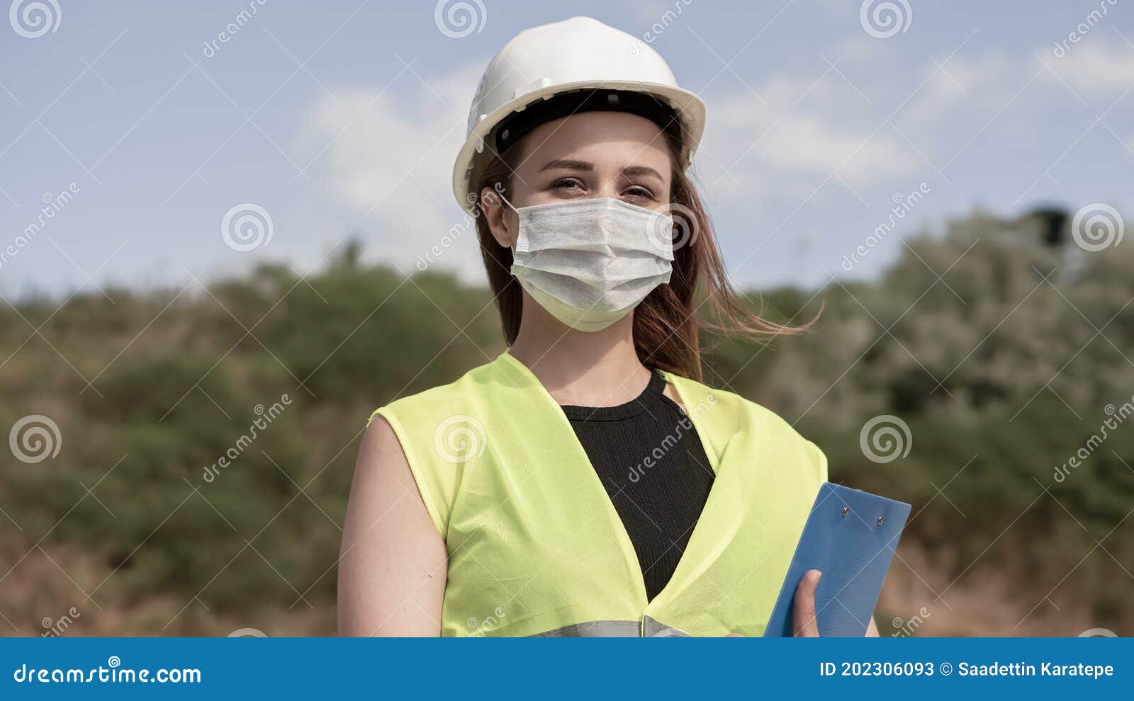 Portrait of Young Female Construction Worker or Engineer with White ...