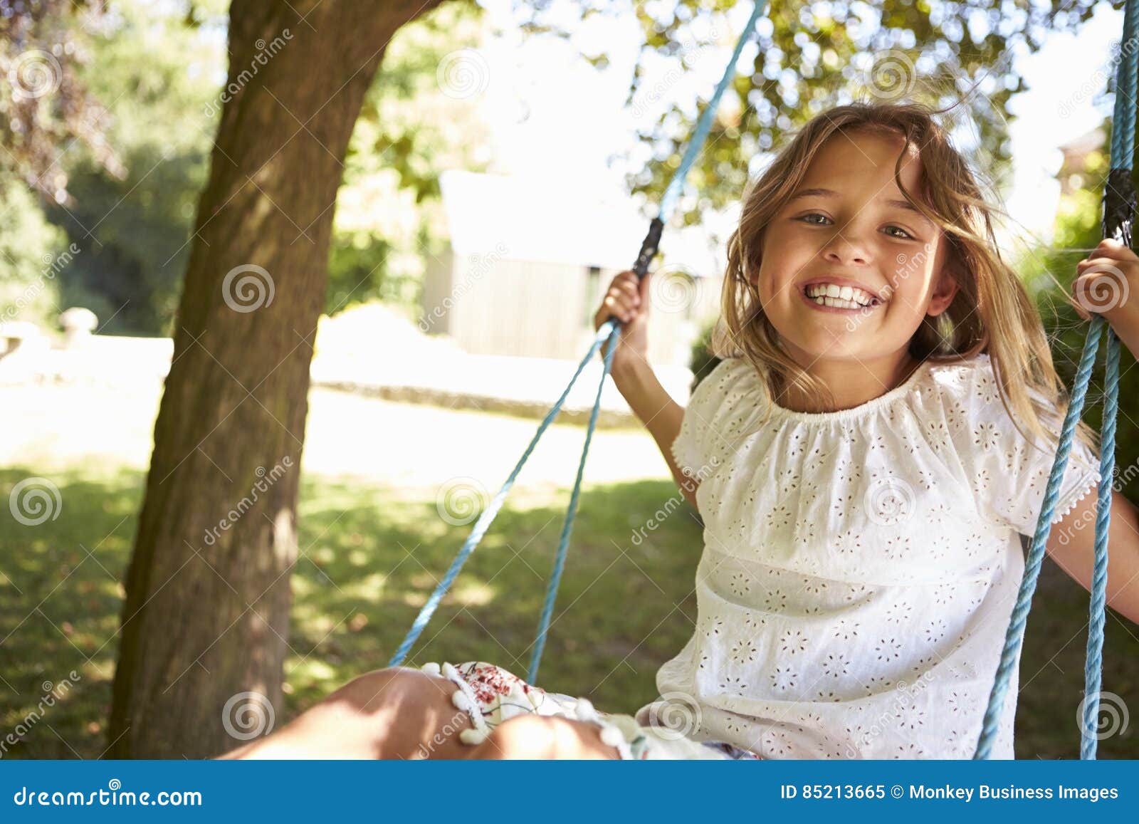 Portrait of Young Girl Playing on Tree Swing Stock Image - Image of ...