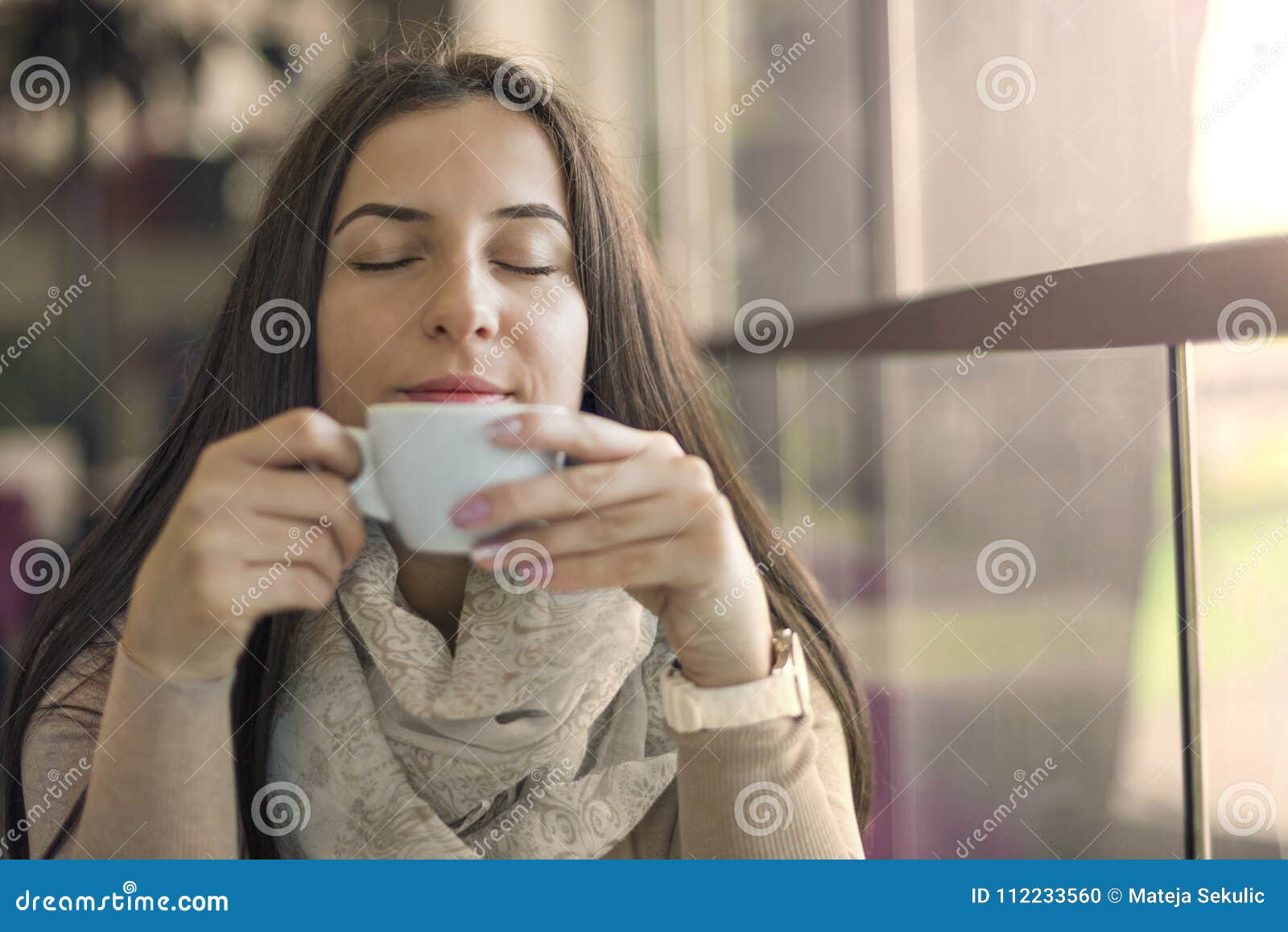 Portrait of Young Gorgeous Female Drinking Cup of Coffee and Enjoying ... Portrait of Young Gorgeous Female Drinking Cup of Coffee and Enjoying ...