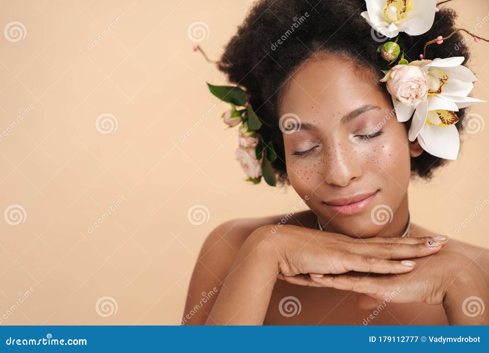 Portrait Of Half Naked African American Woman With Flowers In Her Hair