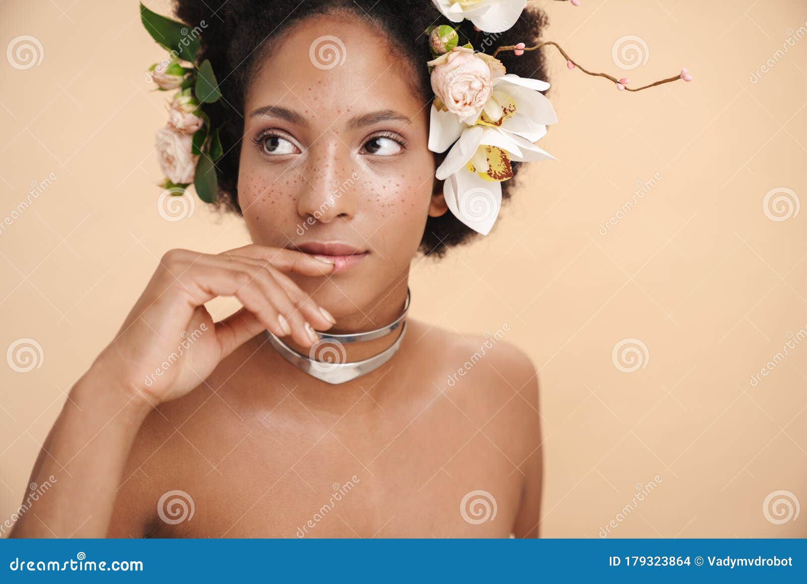 Portrait Of Half Naked African American Woman With Flowers In Her Hair