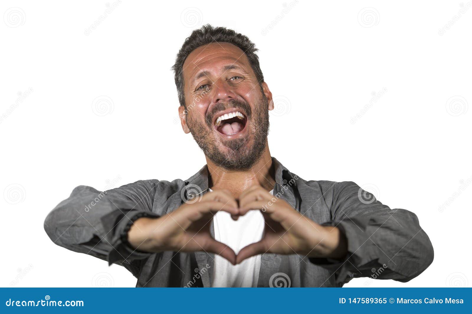 Portrait Of Young Handsome And Attractive Happy Man Doing Love Heart