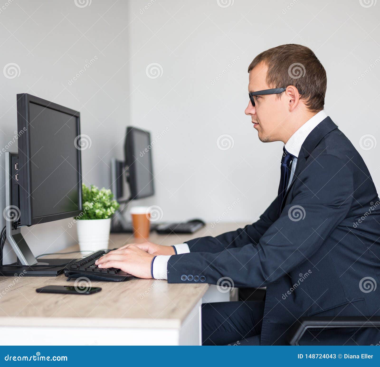 Portrait of Young Handsome Business Man Using Computer in Modern Office ...