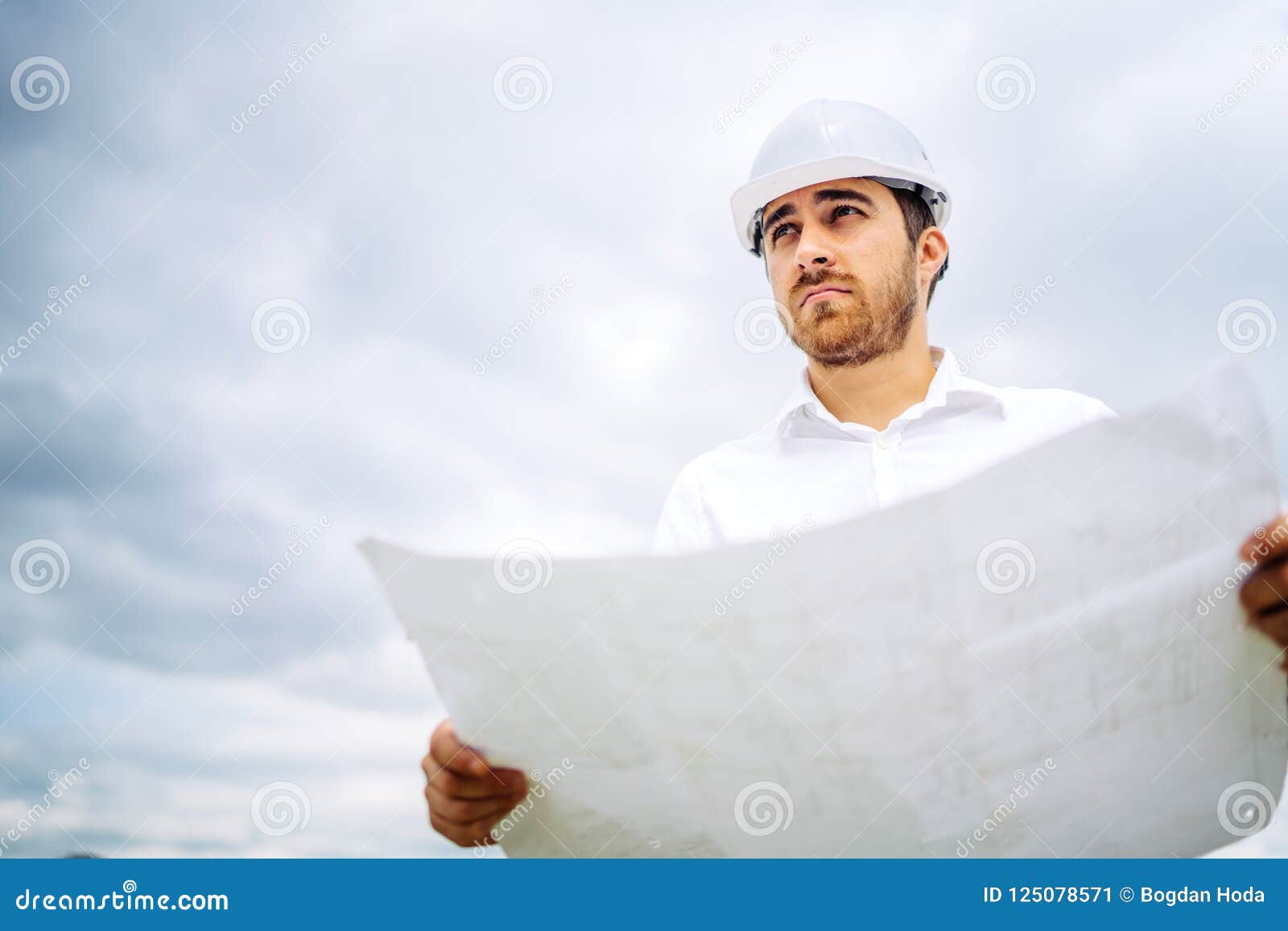 Portrait of Handsome Civil Construction Engineer Working on ...