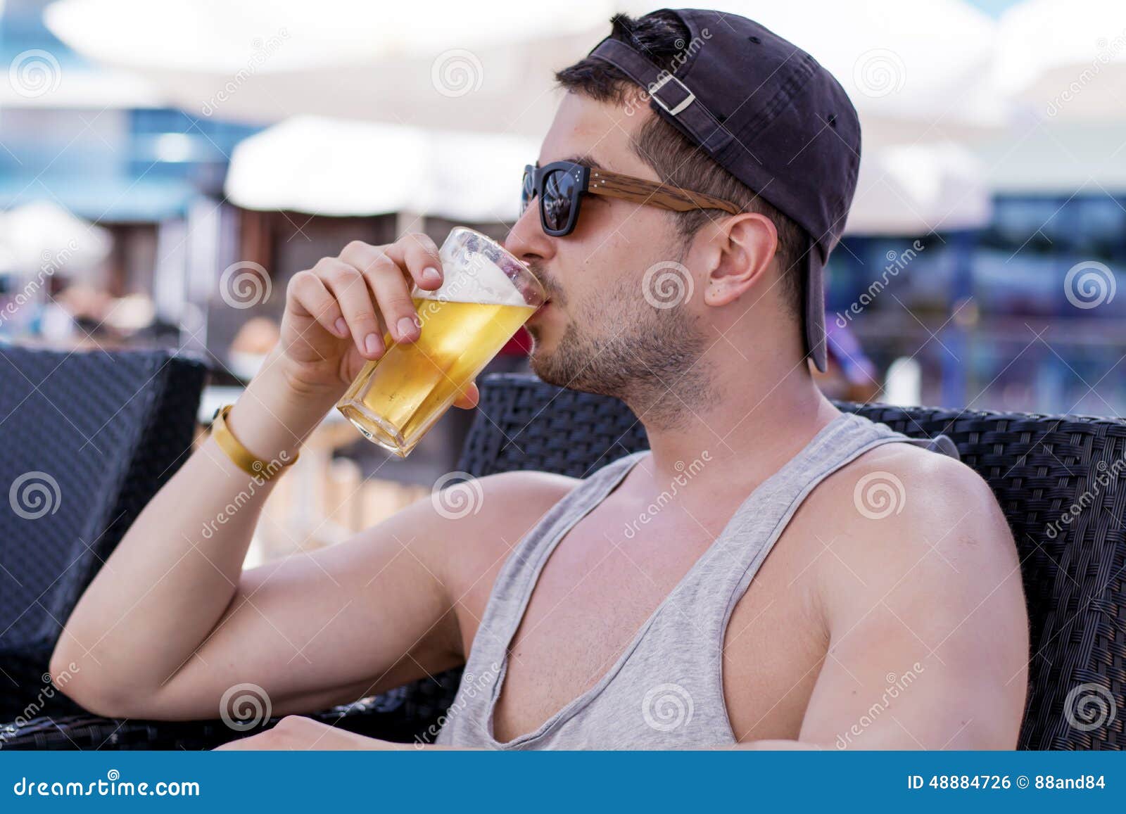 Portrait of Young Handsome Man Drinking Cold Refreshing Beer Stock ...