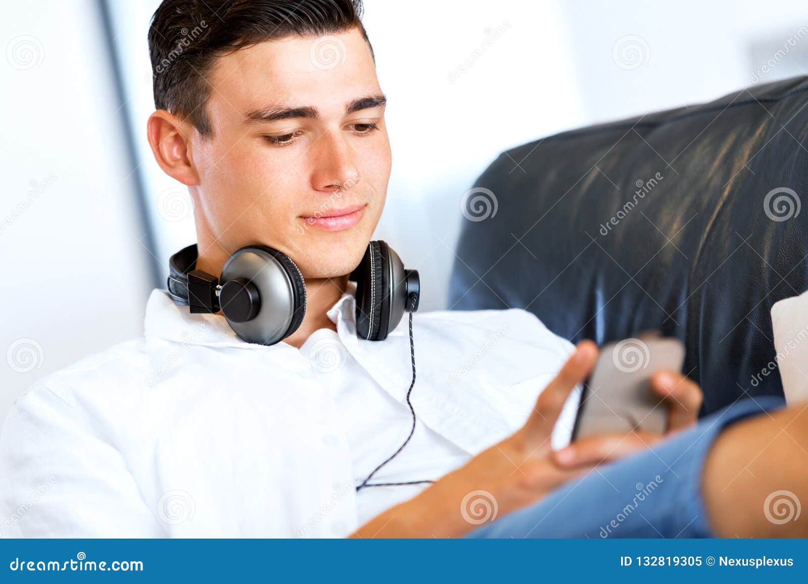Portrait of Young Man Holding Phone Stock Image - Image of cheerful ... Portrait of Young Man Holding Phone Stock Image - Image of cheerful ...