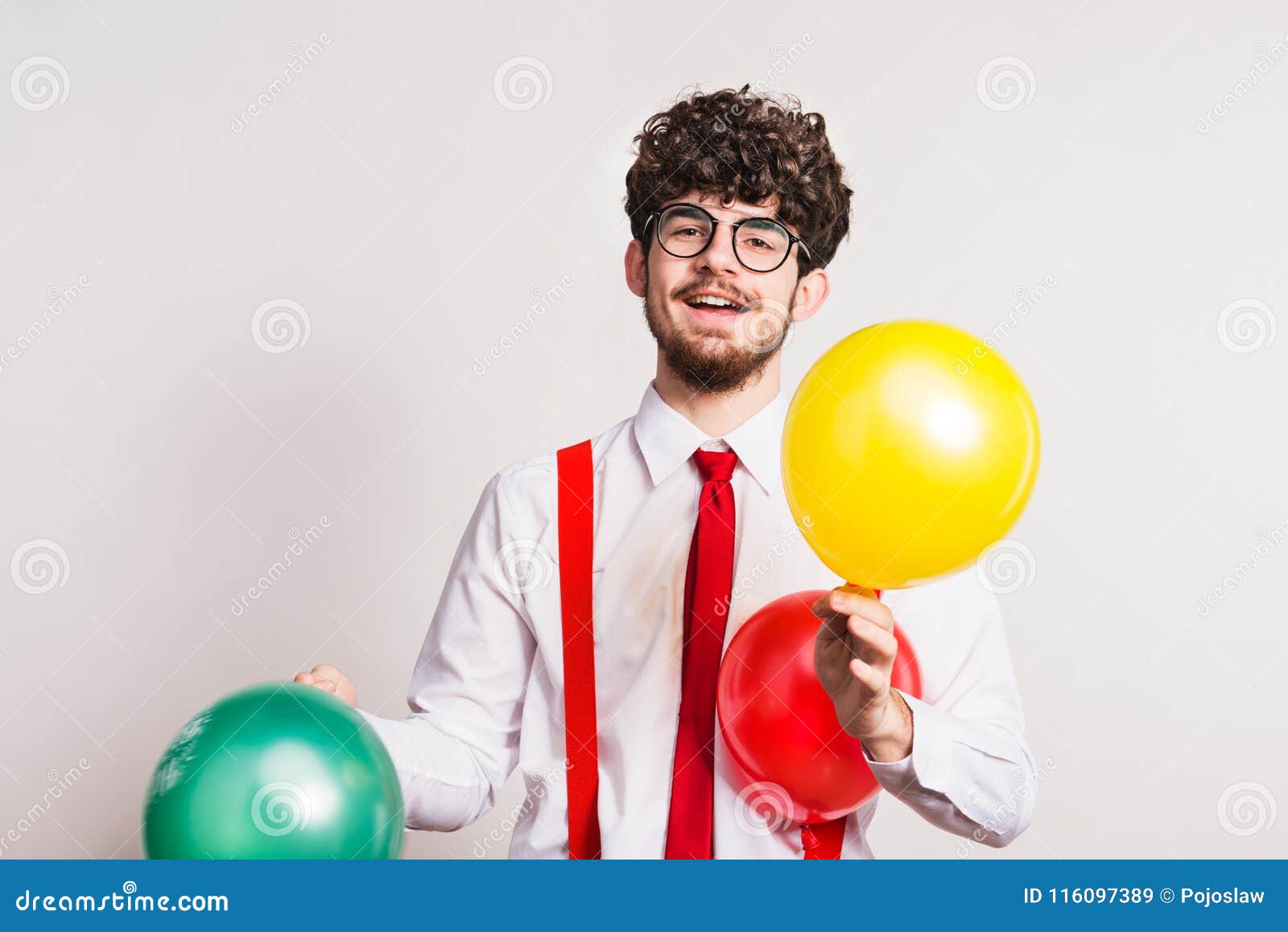 Portrait of a Young Man with Balloons in a Studio. Stock Image - Image ...