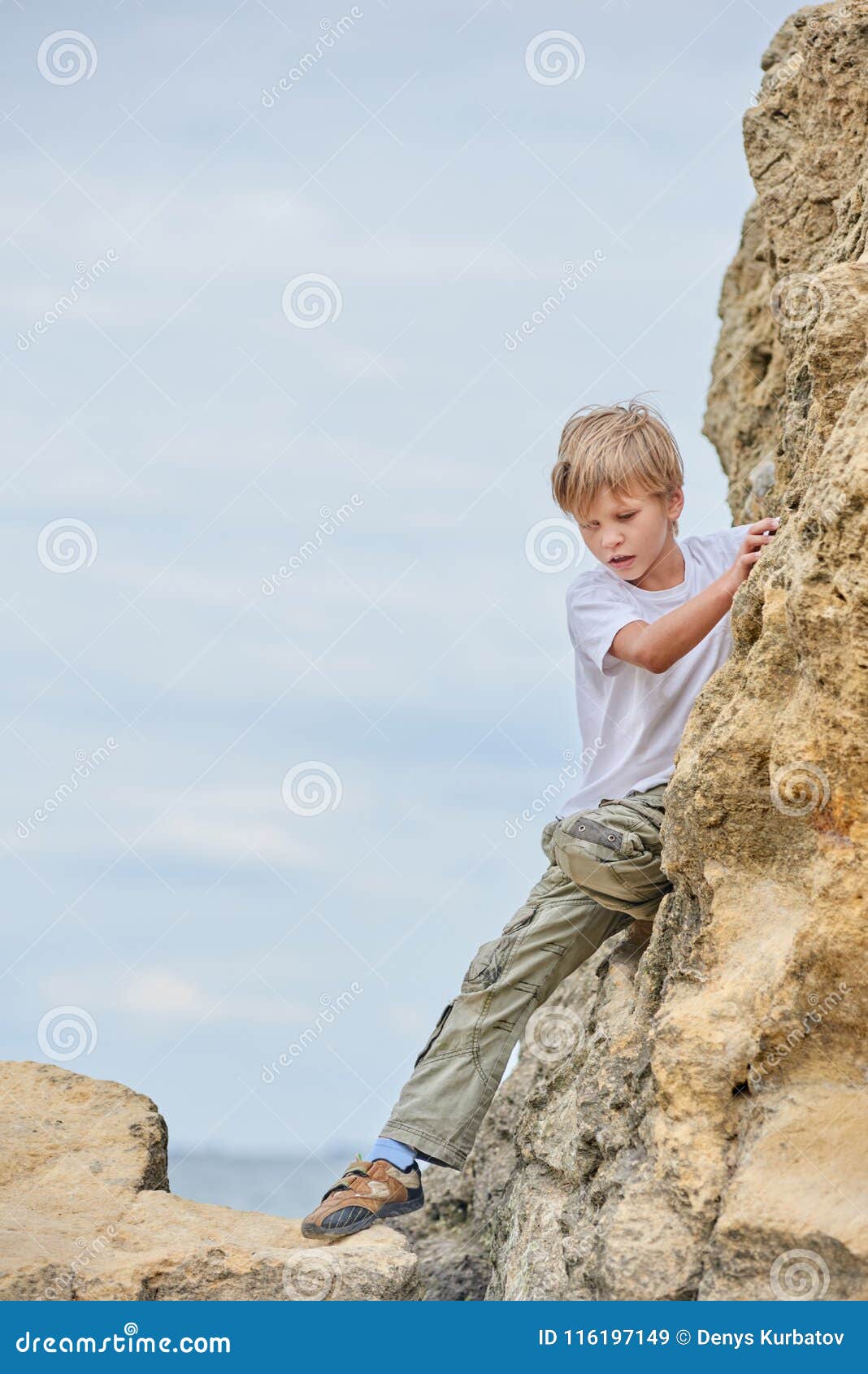 Boy exploring the rocks stock image. Image of outside - 116197149