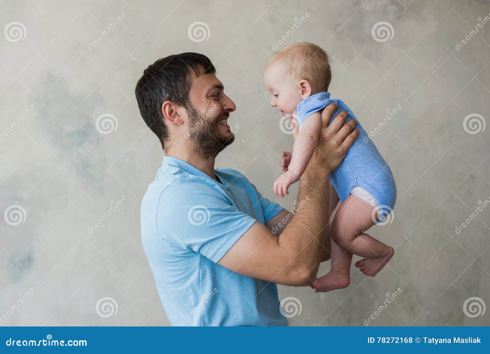 Portrait of Young Happy Man Holding His Sweet Baby Stock Photo - Image ... Portrait of Young Happy Man Holding His Sweet Baby Stock Photo - Image ...