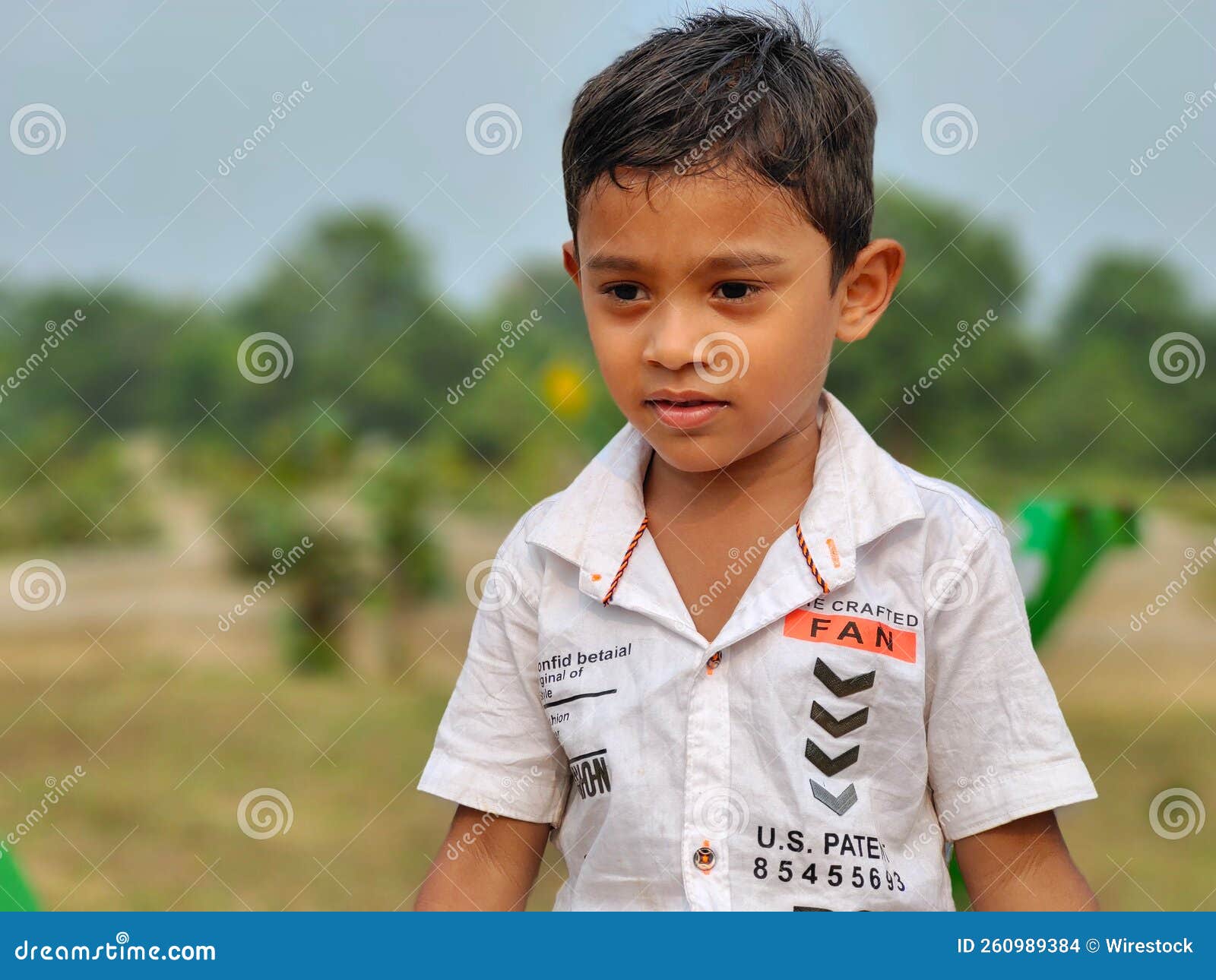 Portrait of a Young Indian Boy with a Curious Look Outdoors Stock Photo - Image of curious, park ...
