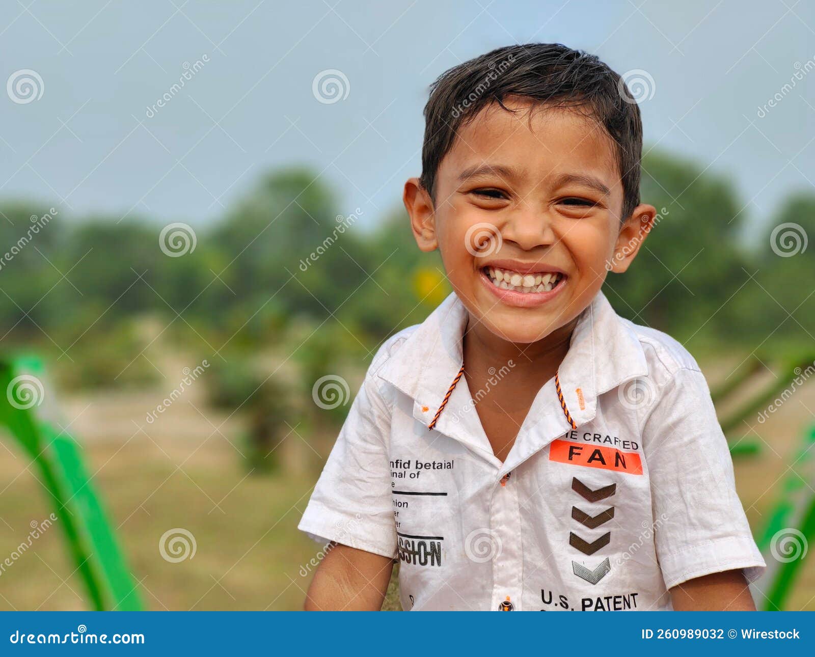Portrait of a Young Indian Boy Laughing while Looking at the Camera ... Portrait of a Young Indian Boy Laughing while Looking at the Camera ...