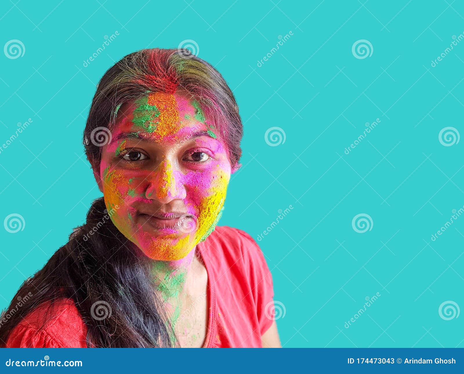 Portrait of a Young Lady with Holi Colours Smiling at the Camera with ...
