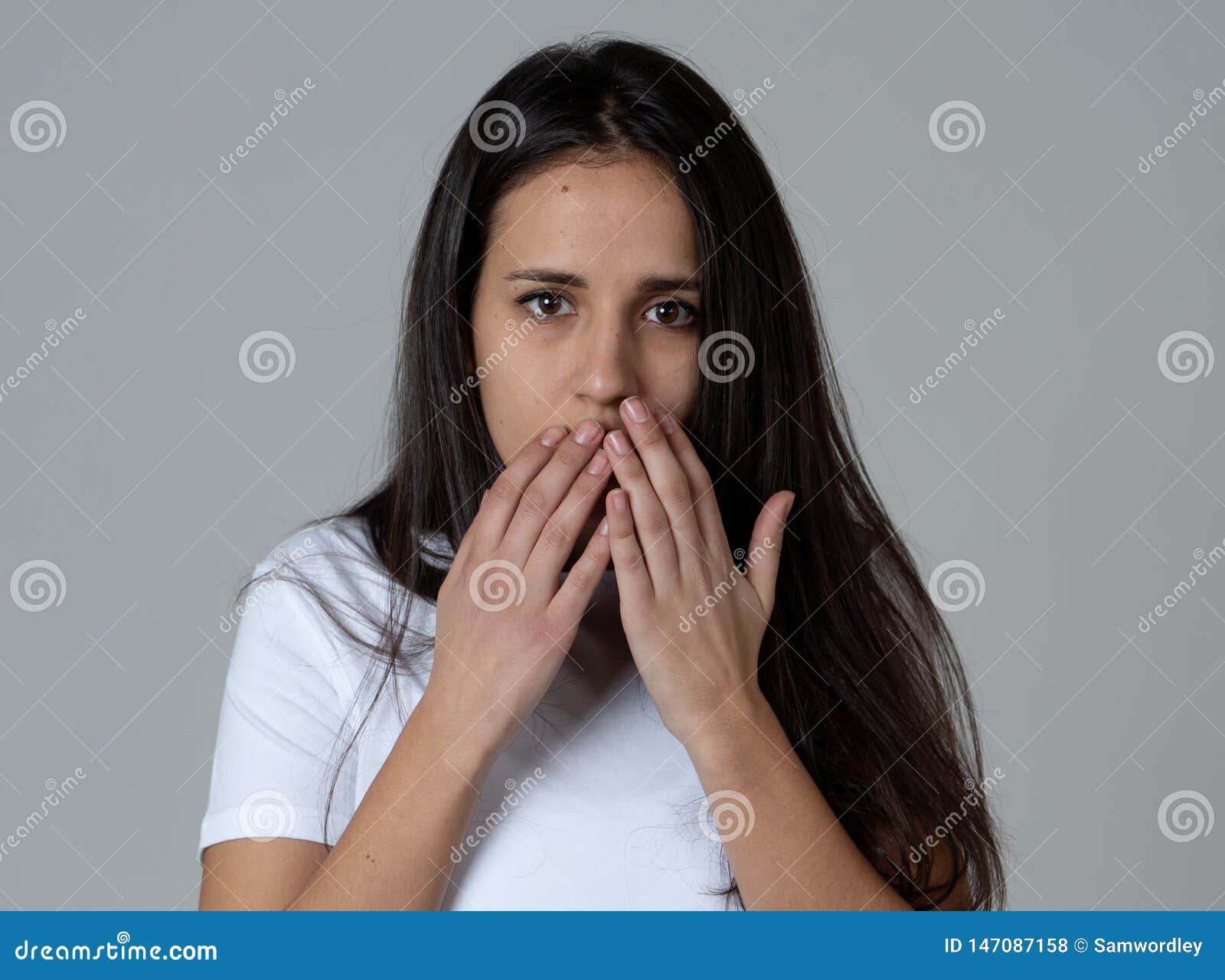 Portrait Of A Young Attractive Woman Looking Scared And Shocked Human