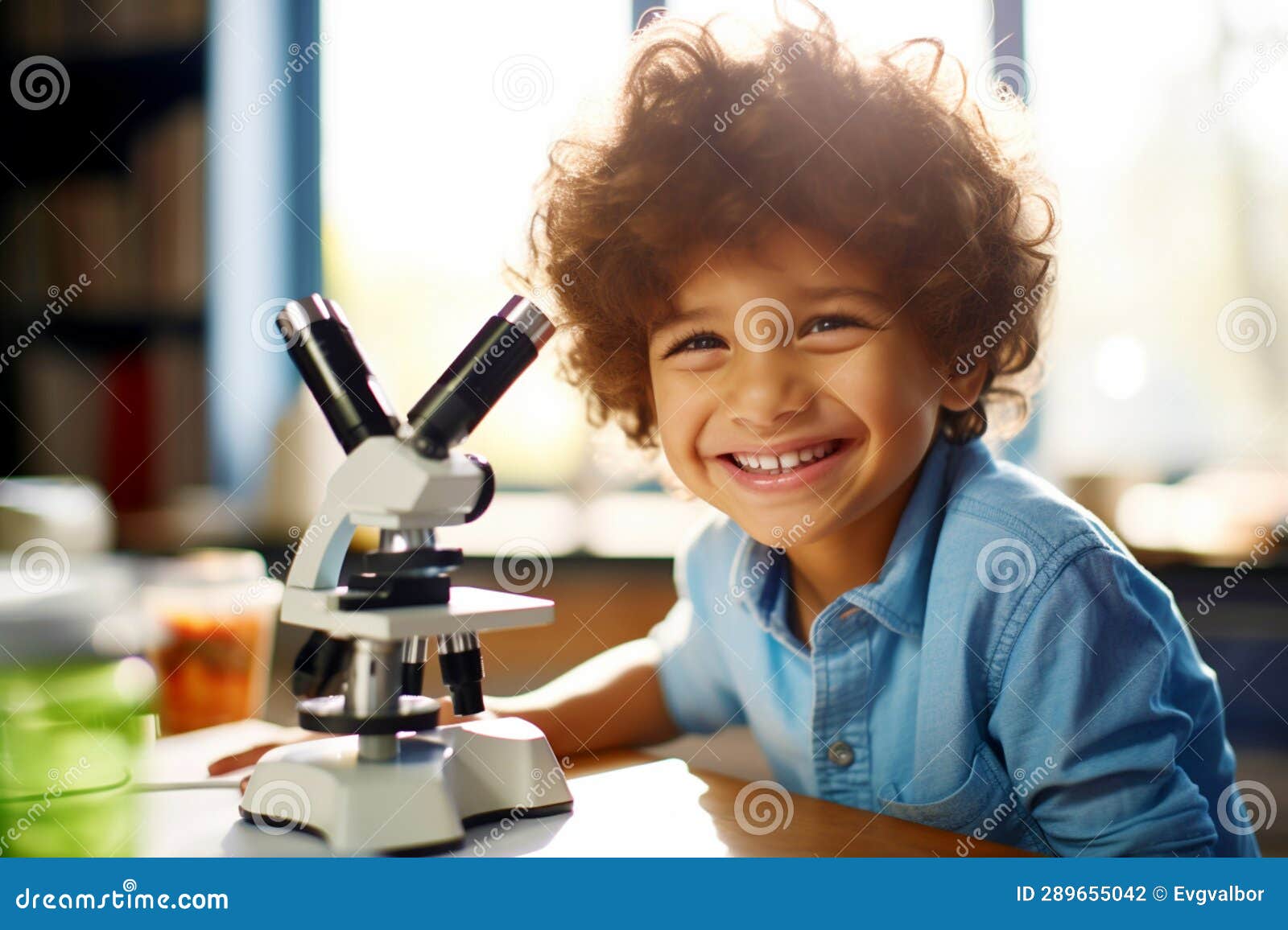 Portrait of a Young Little Boy Scientist with a Microscope. Learning ...