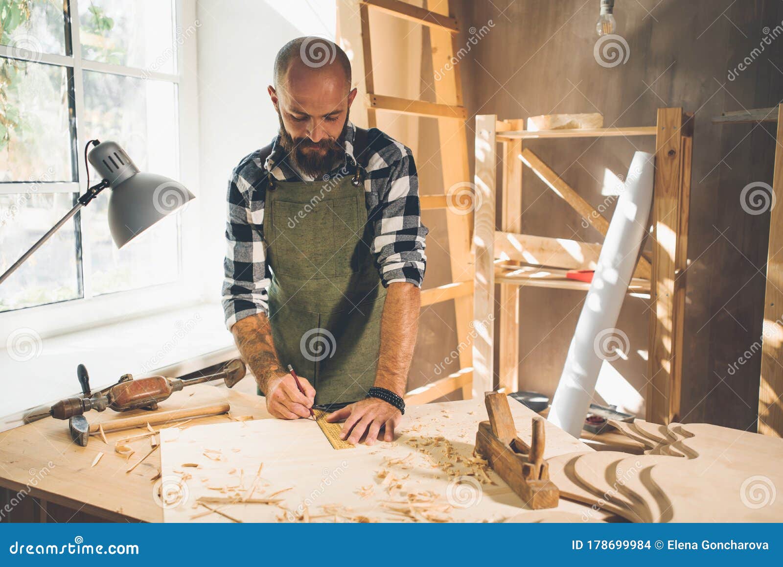 Portrait of a Young Male Carpenter Who Works in His Workshop. Stock ...