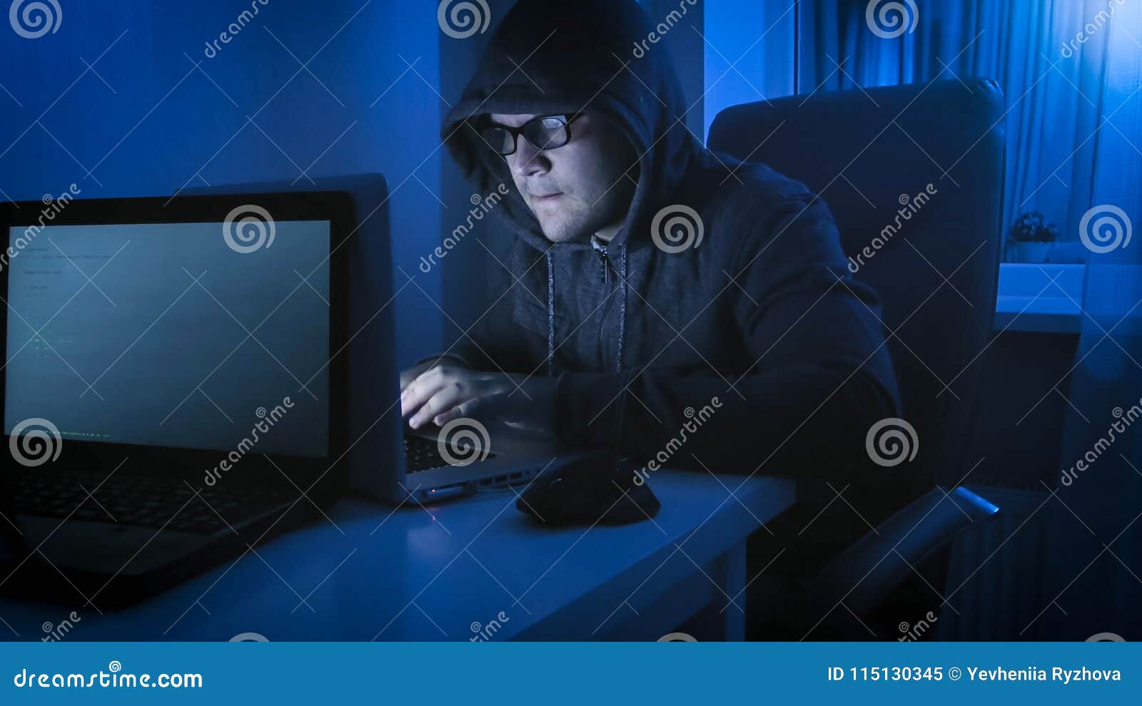 Portrait of Young Male Cyber Criminal Working on Computer at Night ...