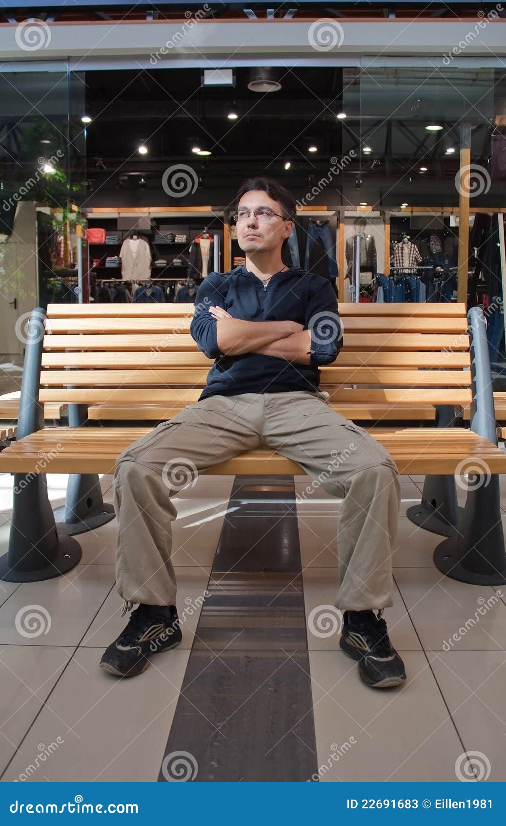 Portrait of Young Man on Bench in Mall Stock Image - Image of mall ...