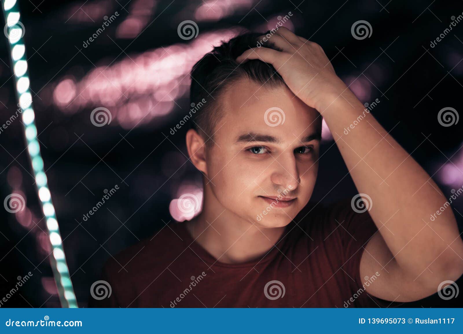 Portrait of a Young Man on a Blurred Background Stock Image - Image of ...