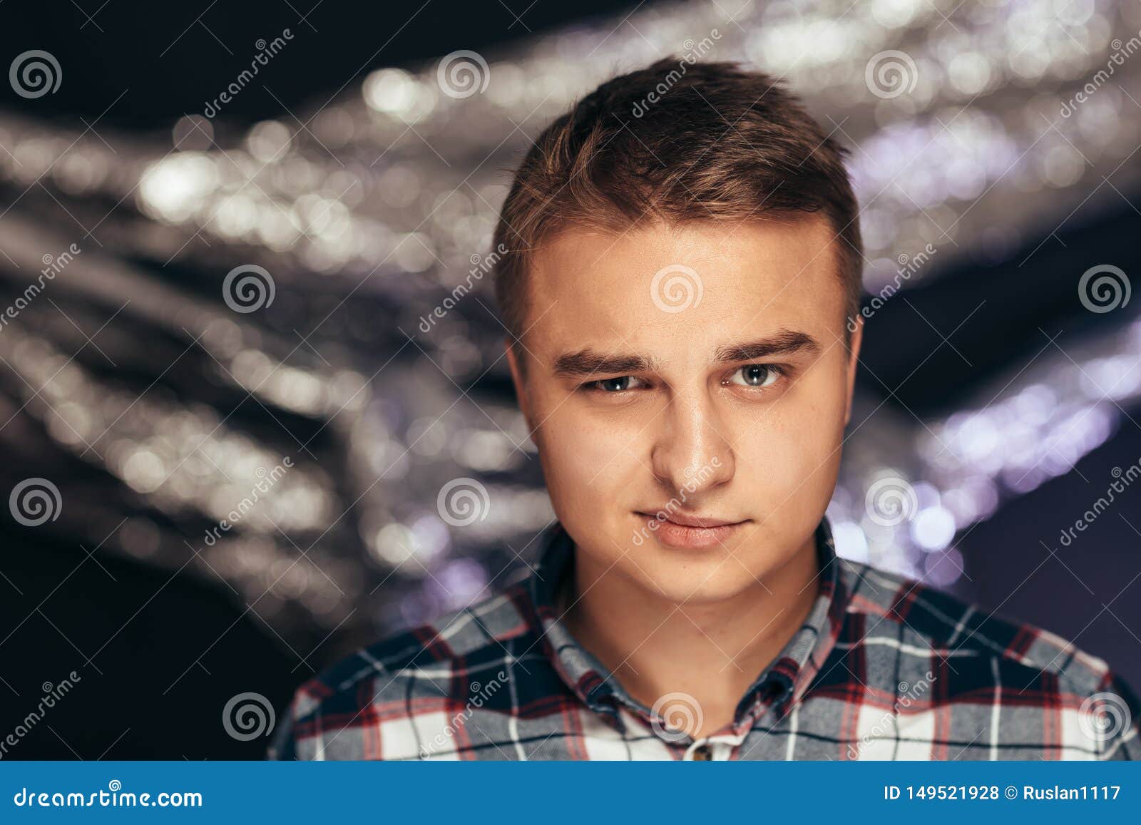 Portrait of a Young Man on a Blurred Background Stock Photo - Image of ...