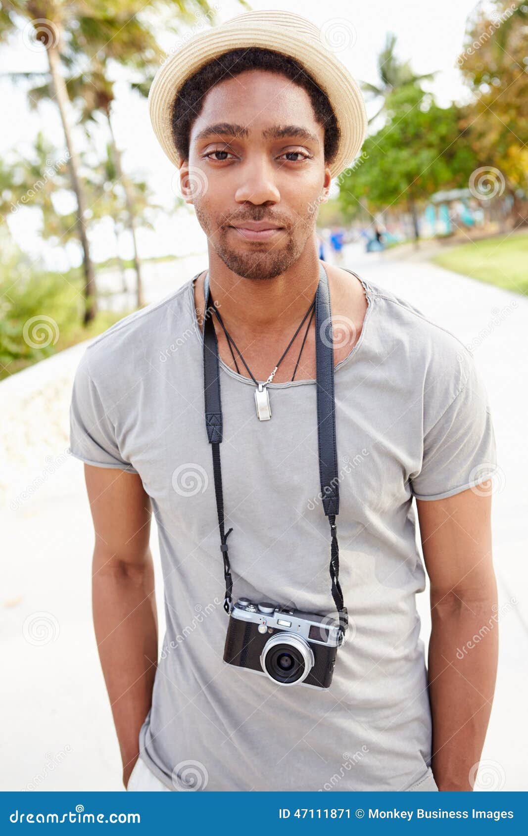 Portrait of Young Man Carrying Camera Stock Image - Image of park ...