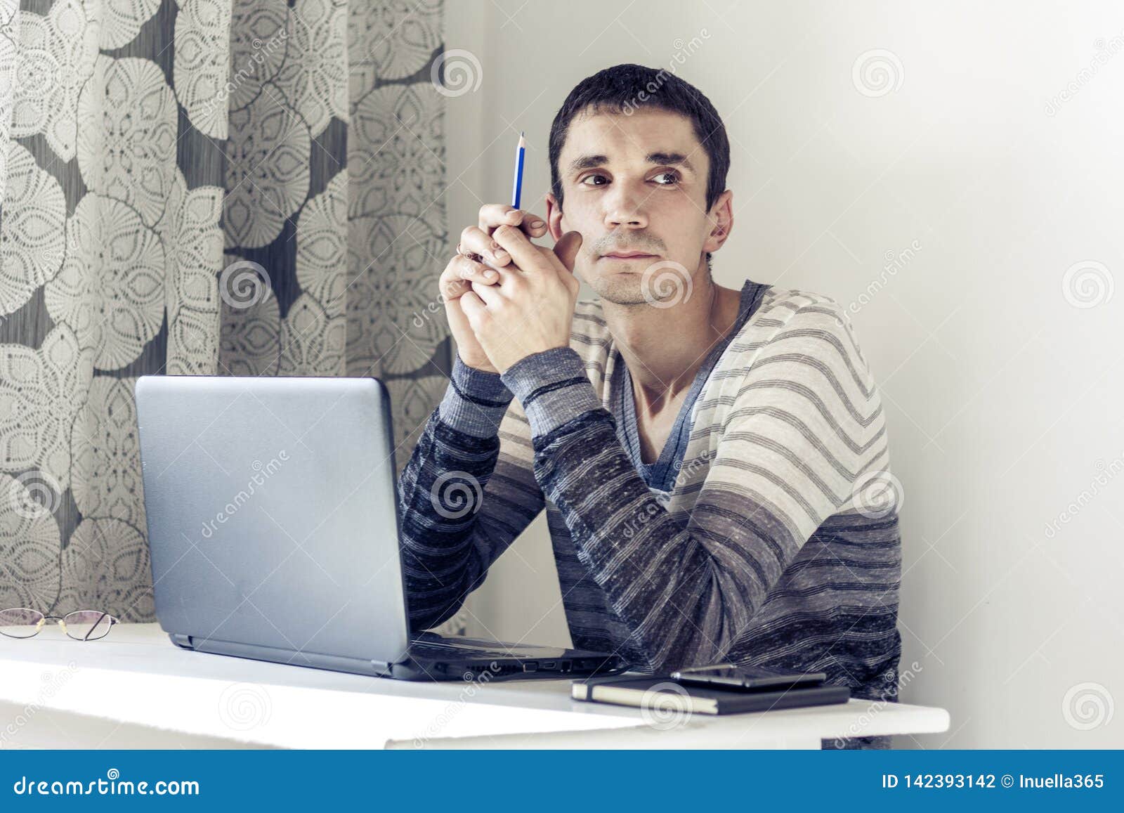 Portrait of Young Man in Casual Wear on the Job Working on Laptop ... Portrait of Young Man in Casual Wear on the Job Working on Laptop ...