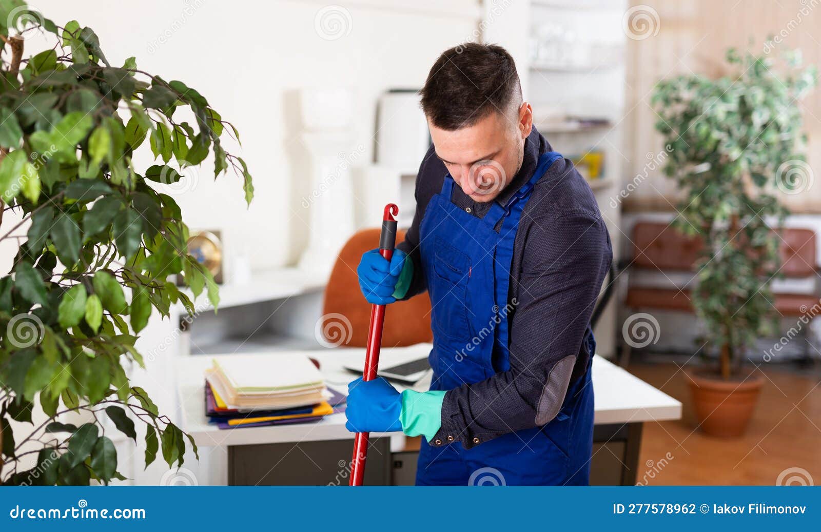 Young Man Cleaner Working at Office Stock Photo - Image of chores ...