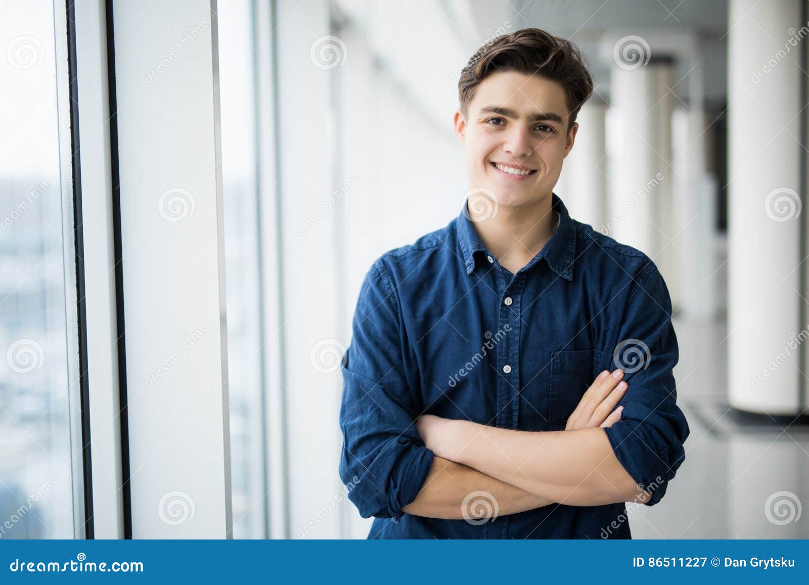 Portrait of Young Man with Crossed Hands Near in Window. Stock Image ...