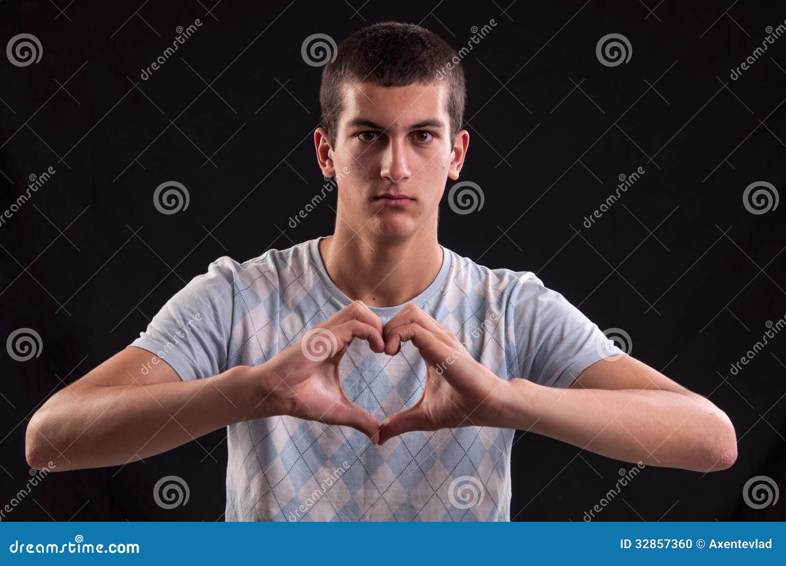 Portrait of Young Man Doing a Heart Gesture Stock Photo - Image of ...
