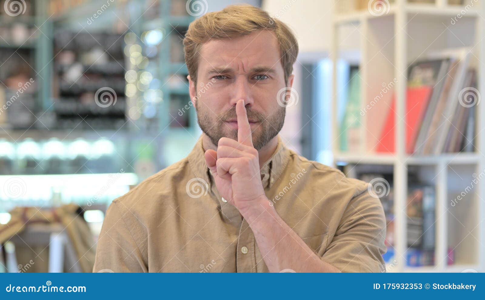 Portrait of Young Man with Finger on Lips, Silence Sign Stock Image ...