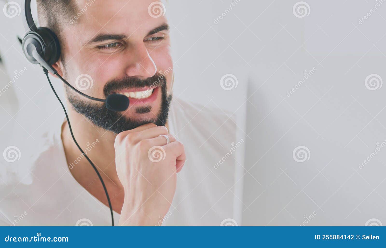 Portrait of a Young Man with a Headset in Front of a Laptop Computer ...